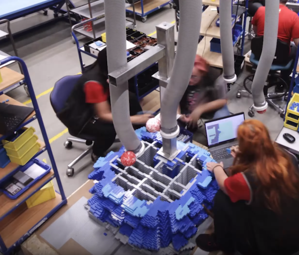 Behind the building of the giant LEGO Fortnite Llamas