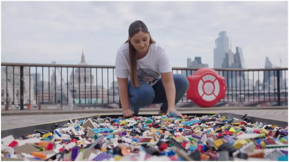 Jacqueline Jossa walks barefoot over LEGO for charity